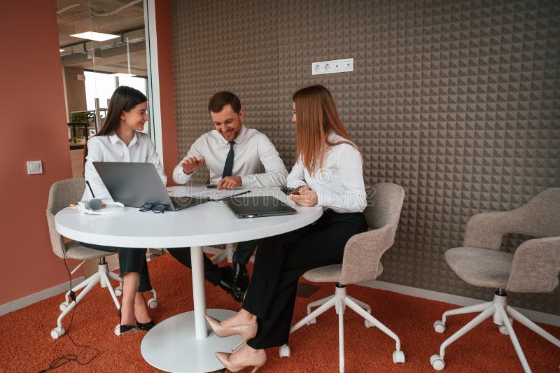 Three Business People are Working in the Office Together Stock Photo ...