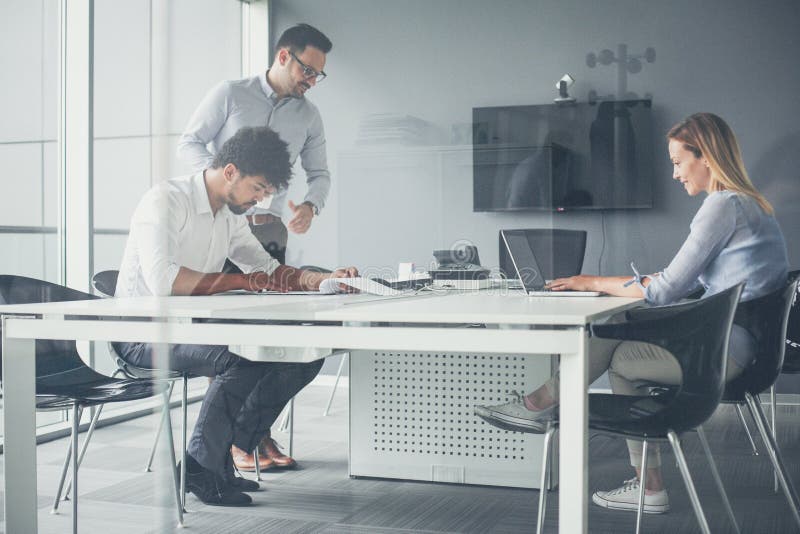 Three Business People Working in Office. Stock Photo - Image of inside ...