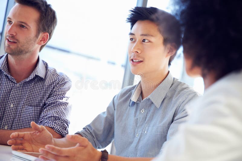 Three Business Professionals Working Together Stock Photo - Image of ...