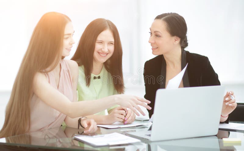 Three Business Women Discussing Work Issues in the Office Stock Image ...