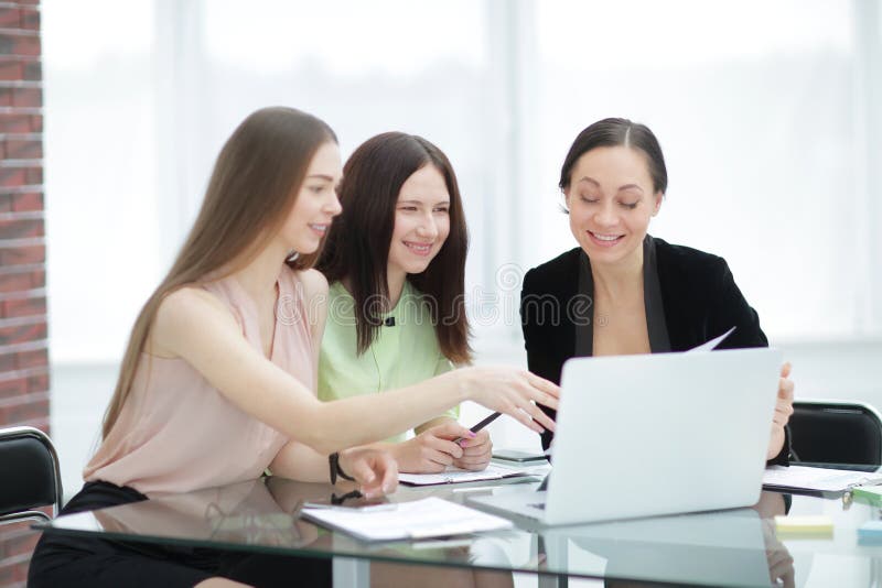 Three Business Women Discussing Work Issues in the Office Stock Image ...