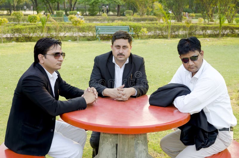 Three Businessmen Discussing Plan in Park Stock Image - Image of ...