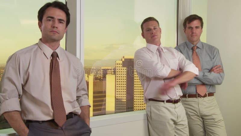 Three Businessmen Standing by Window in Office Stock Video - Video of ...