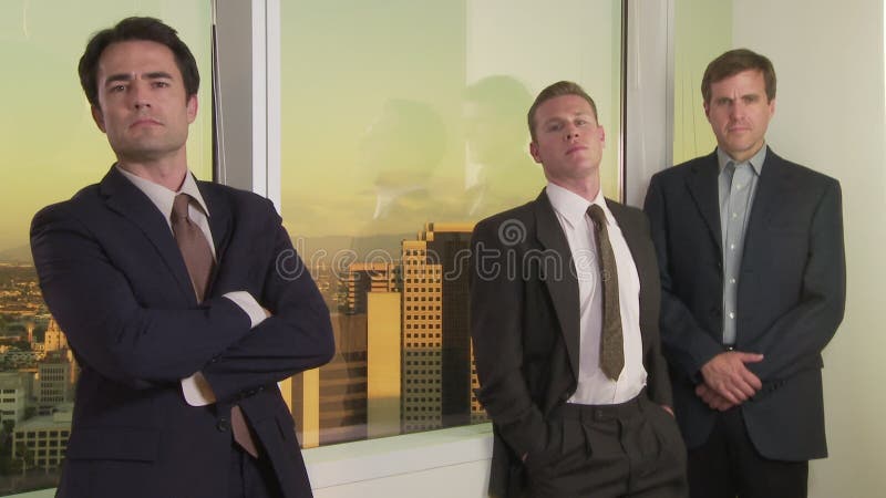 Three Businessmen Standing by Window in Office Stock Video - Video of ...