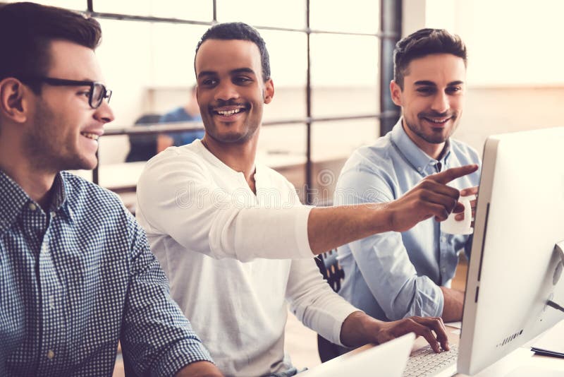 Three businessmen working stock photo. Image of confident - 88374994