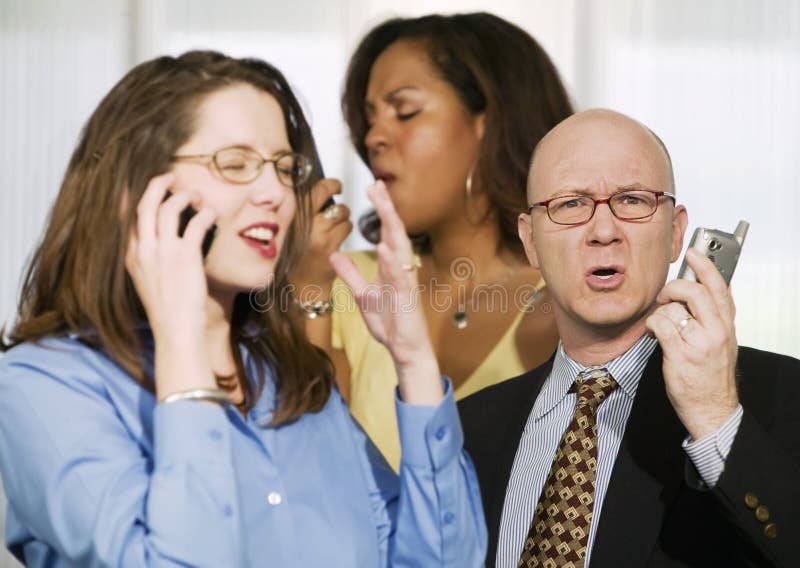 Three Businesspeople On Cell Phones Picture. Image: 4645274