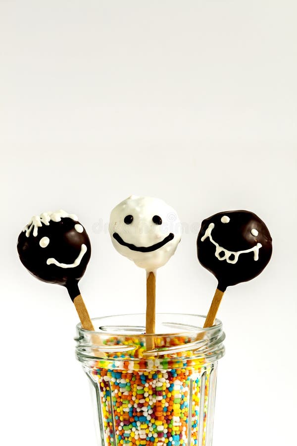 Three Cake Pops with Painted Smiles Isolated Stock Photo - Image of ...