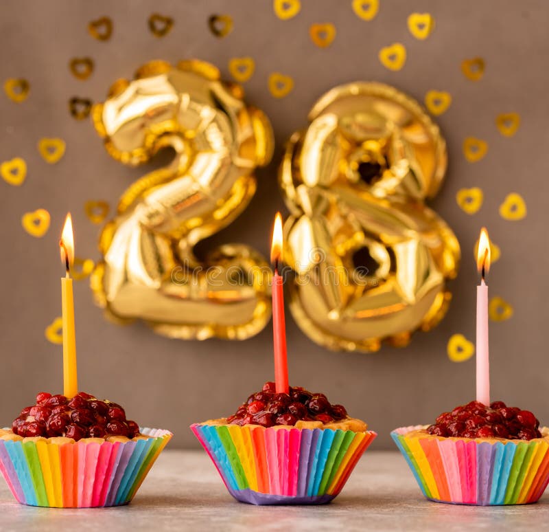 Three Cakes-baskets with Candles on the 28th Birthday Stock Photo ...