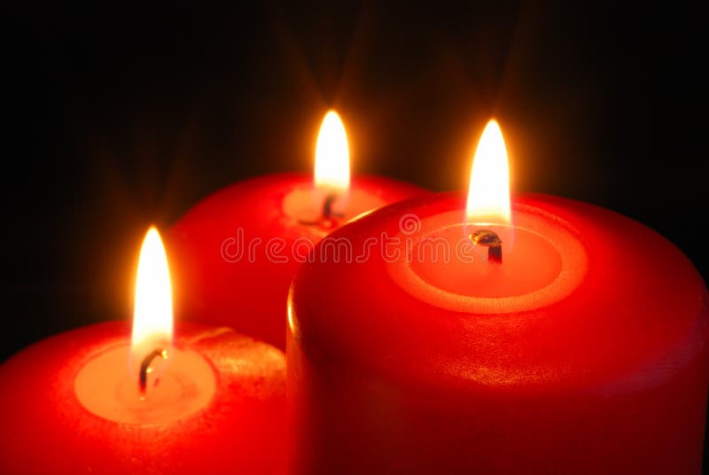 Three candles stock photo. Image of dark, light, bright - 1477184