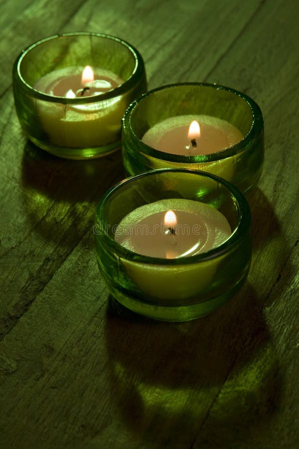 Three Candles stock image. Image of wood, glass, yellow - 6429915
