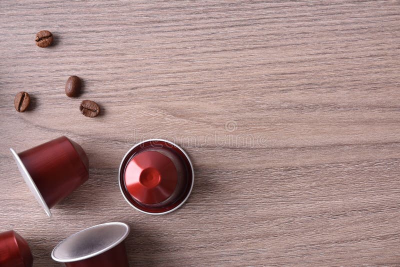 Three Capsules Espresso Coffee on Wooden Table Top View Stock Photo ...