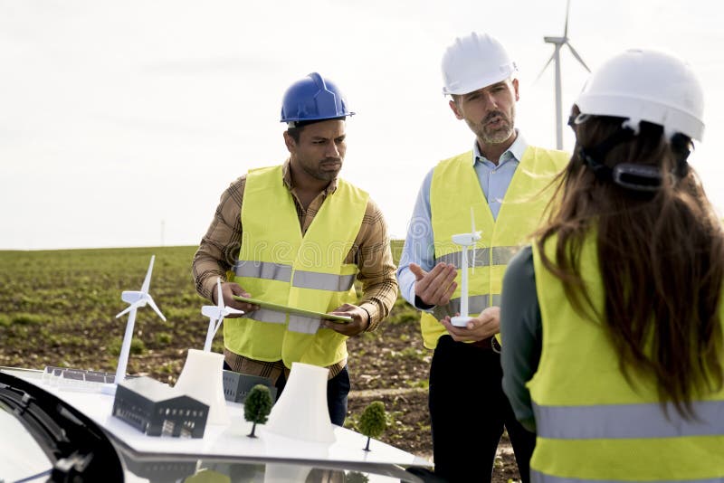 Group of Workers Standing on Wind Turbine Field Stock Image - Image of ...