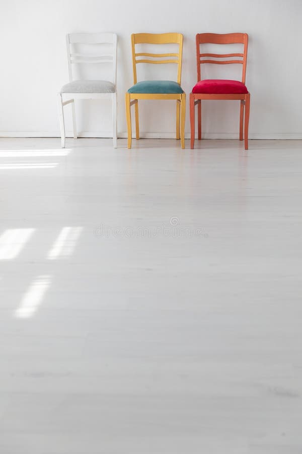 Three Vintage Chairs in the Interior of a White Room Stock Image ...