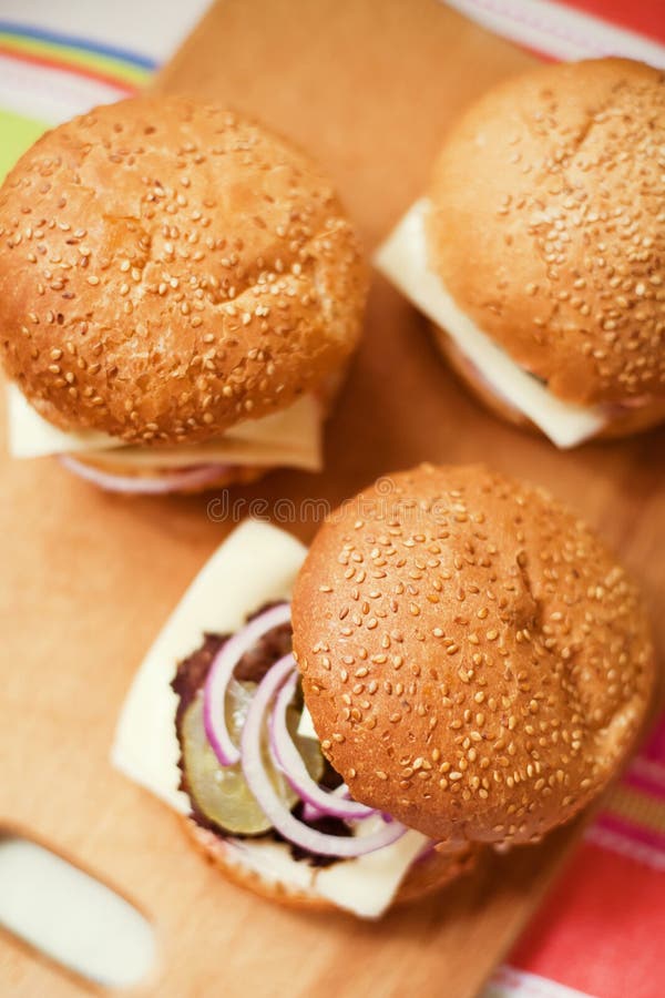 Three Cheeseburgers with Beef Patties, Flat Lay Stock Photo - Image of ...