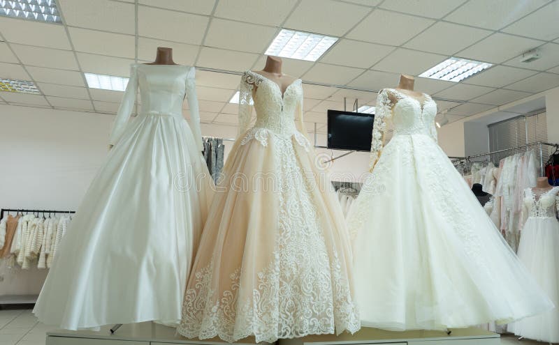 Three Chic Wedding Dresses on Mannequins. Three Different Models of ...