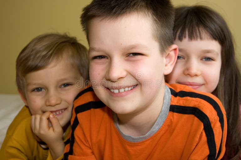 Three Children with Beaming Smiles Stock Photo - Image of contentment ...