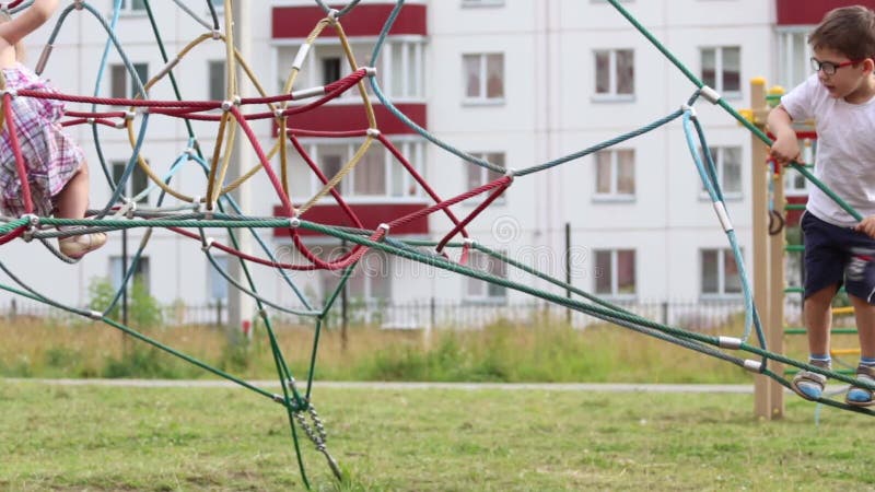 Three Children Crawl in Net on Playground Stock Video - Video of grass ...