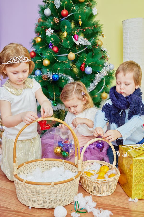 Three Children Decorate Wicker Baskets Grips by Stock Photo - Image of ...
