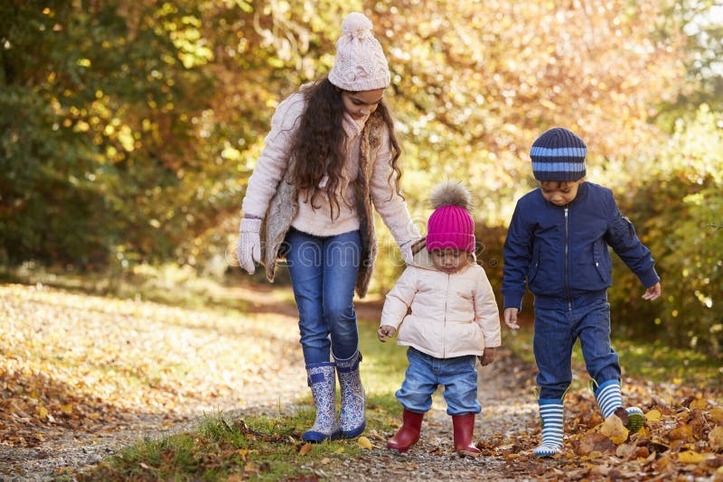 Three Children Enjoying Autumn Countryside Walk Together Stock Image ...