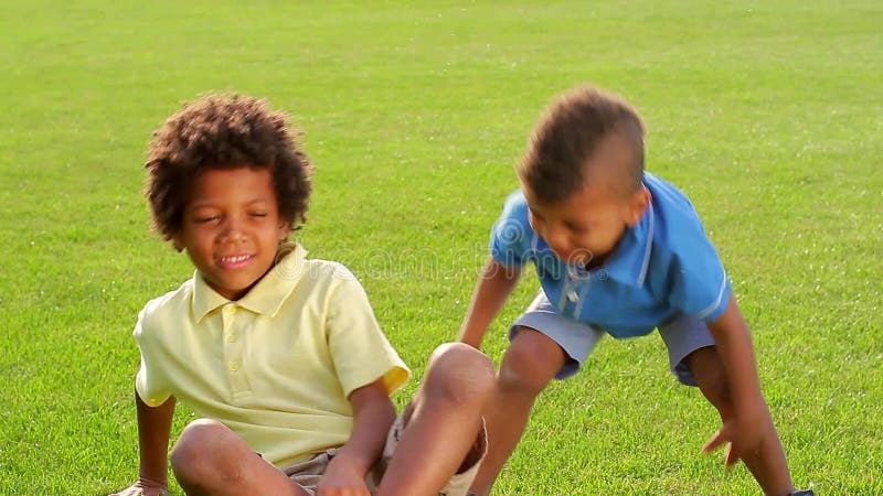 Three Children are Fighting on the Sunny Glade. Stock Footage - Video ...