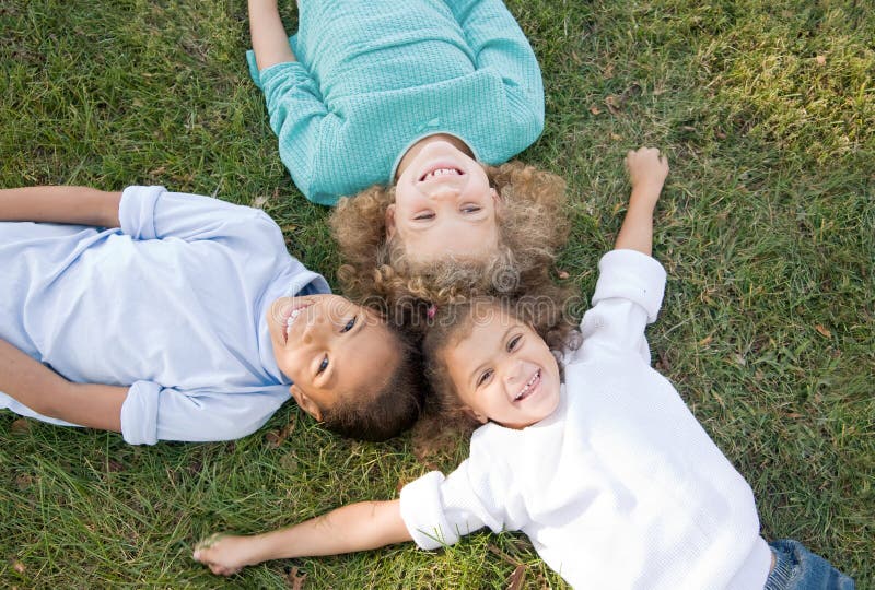 Below View of Happy Three Children Embracing Stock Photo - Image of ...