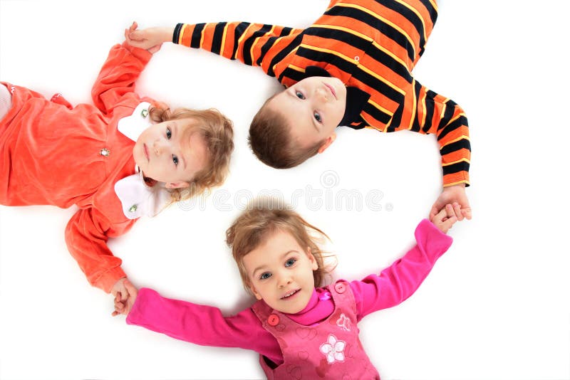 Three children lying stock photo. Image of lying, females - 4386334
