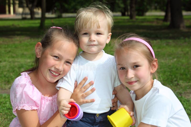 Three Children in Park in Summer Stock Image - Image of grass, cheerful ...
