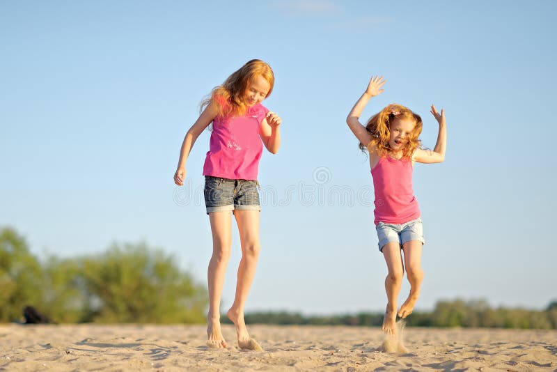 Three Children Playing on Beach Stock Photo - Image of sand, genes ...