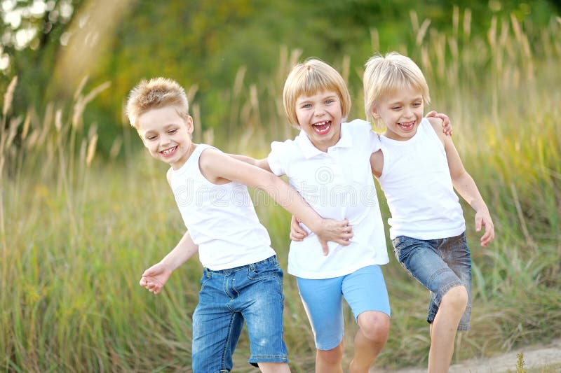 Three children playing stock image. Image of child, girls - 48055713