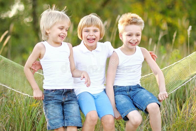 Three children playing stock image. Image of girls, outdoors - 48055725