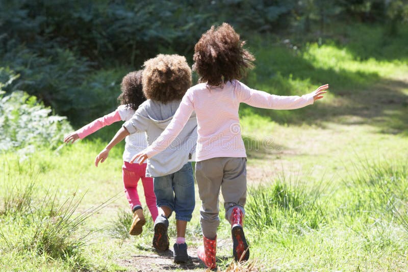 Three Children Playing in Woods Together Stock Image - Image of ...