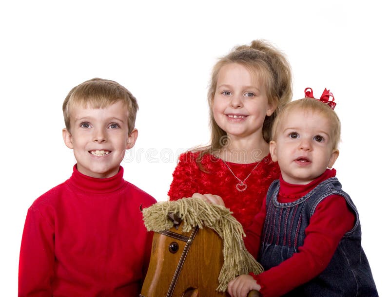 Three Children and Rocking Horse Stock Photo - Image of person, happy ...