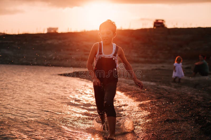 Three Children Running Along Beach Stock Image - Image of people ...