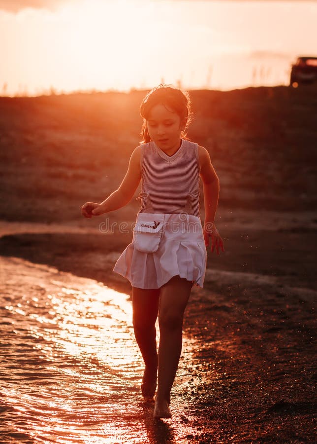 Three Children Running Along Beach Stock Photo - Image of siblings ...