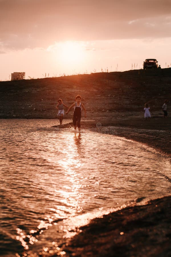 Three Children Running Along Beach Stock Image - Image of active ...
