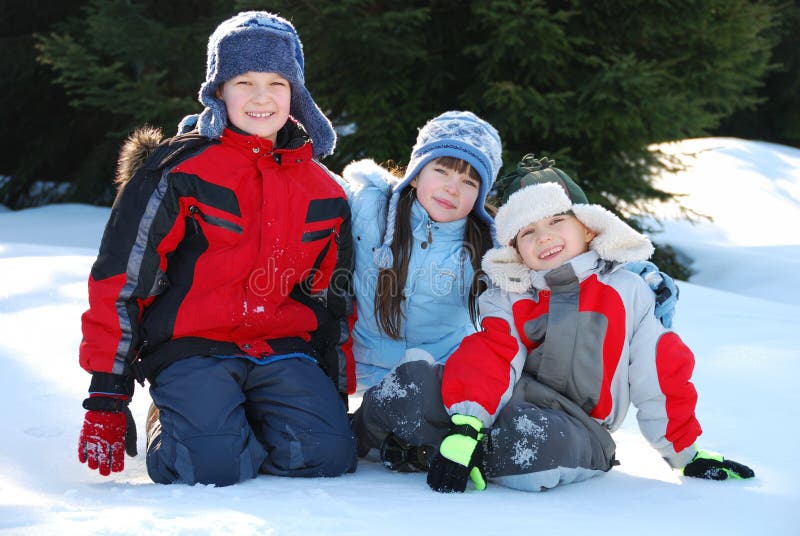 Happy children in snow stock photo. Image of colorful - 15738132