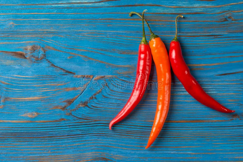 Three red chilli in water stock photo. Image of drop - 13868960