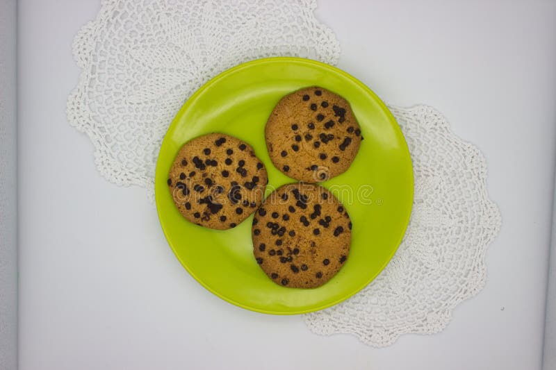 Three Chocolate Chip Cookies on Green Plate Stock Photo - Image of ...