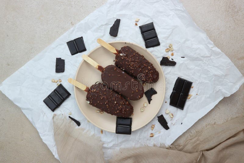 Three Chocolate Popsicles with Sprinkled Nuts Stock Image - Image of ...