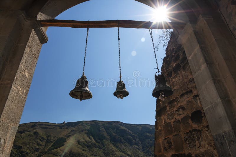 Three Church Bells Hang in the Background of the Mountain Stock Image ...