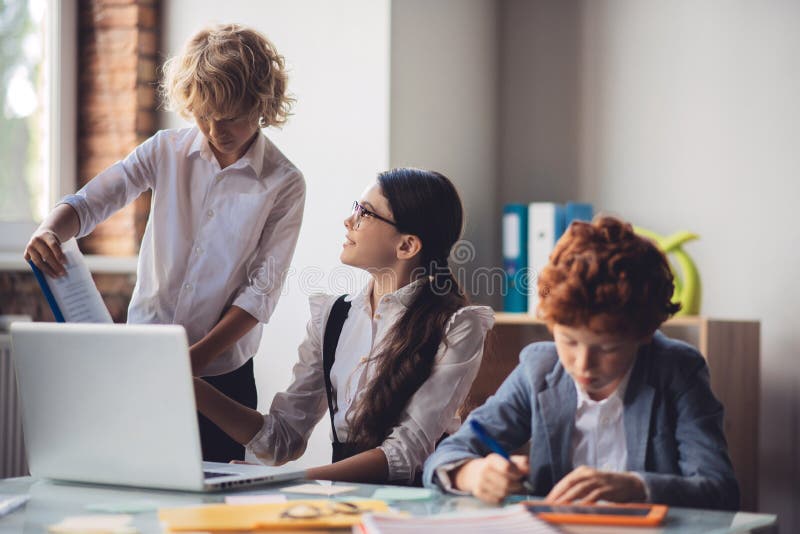 Three Classmates Working on a Project Together Stock Image - Image of ...