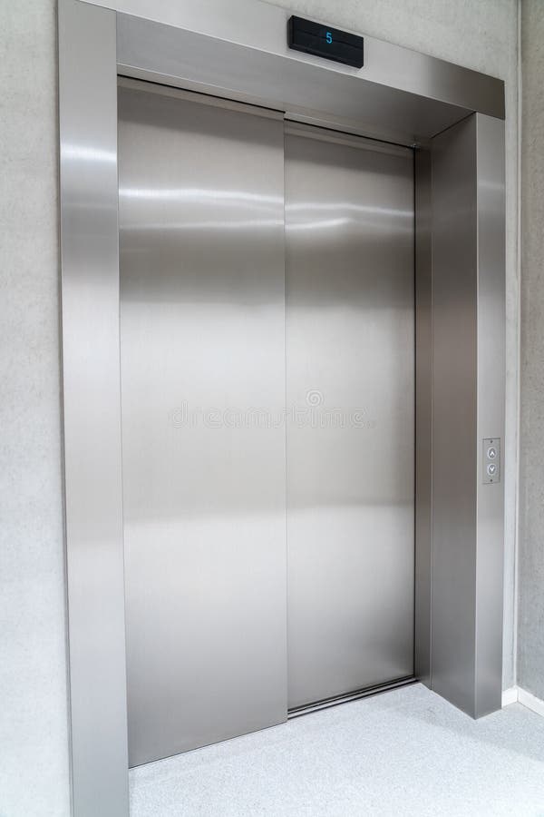 Three Close Elevator in the Hall Stock Photo - Image of gate, lobby ...