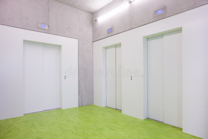 Three Close Elevator in the Hall Stock Photo - Image of door ...