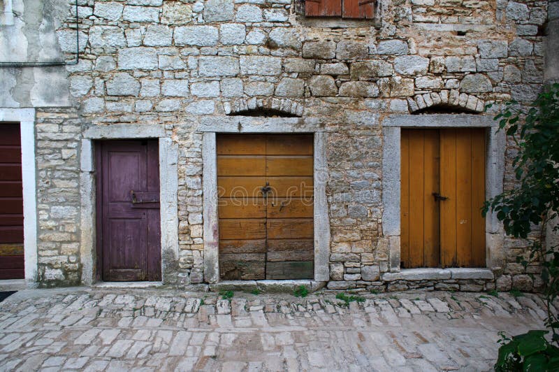 Three Closed Doors in the Old Town Stock Photo - Image of town, wall ...