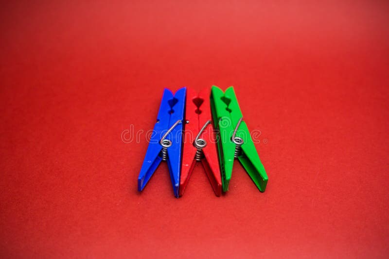 Three clothes pegs stock photo. Image of symbol, abstract - 177550456