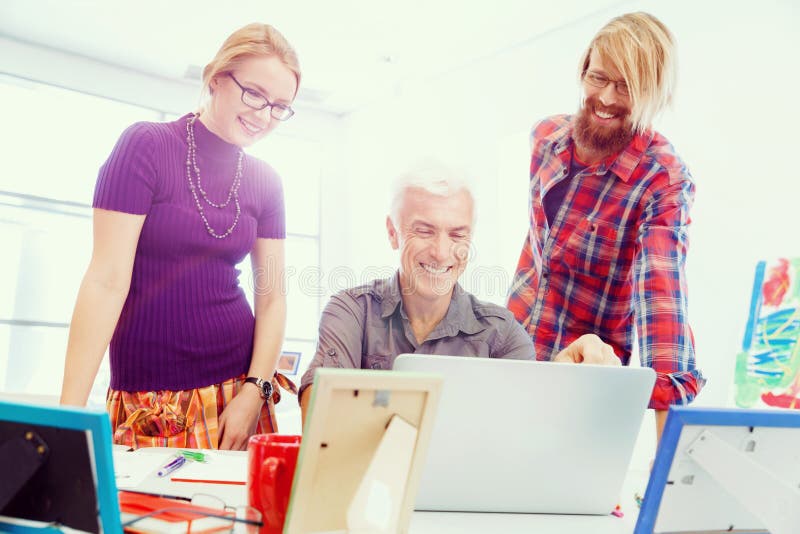 Three Co-workers Working Together Stock Photo - Image of businessman ...