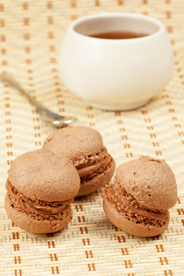 Three Cocoa Dough Sponge Drops with Cream, Cup of Tea Stock Photo ...
