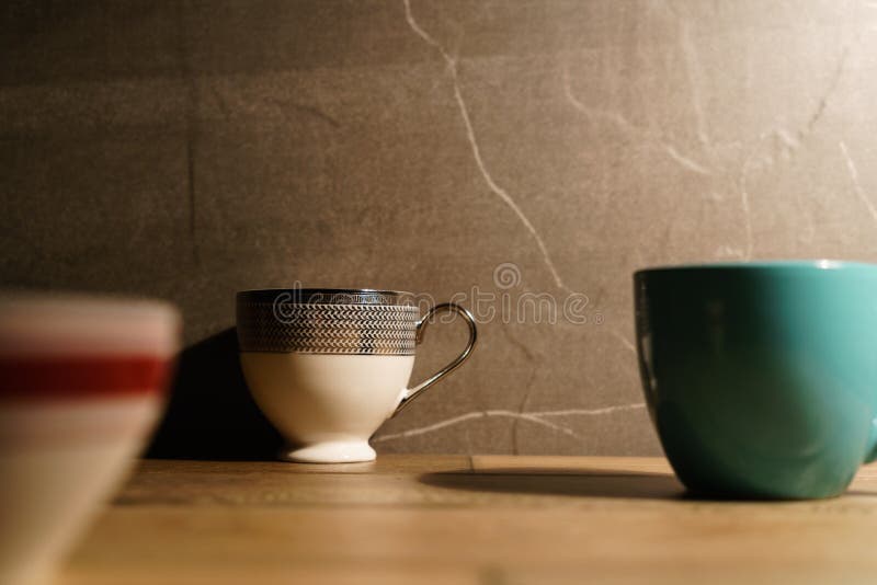 Three Coffee Cups Lay Down on the Table Stock Image - Image of triple ...