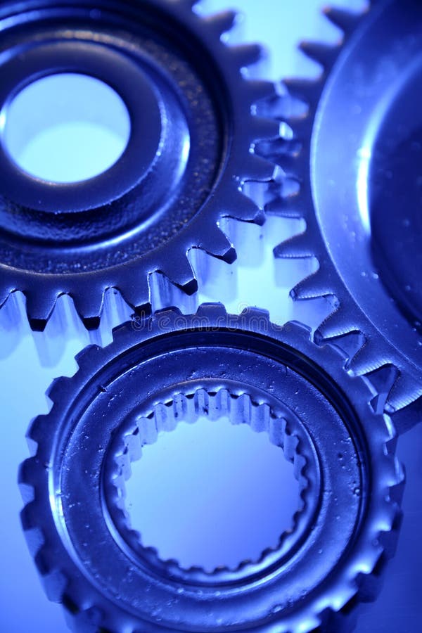 Three cogs together stock image. Image of studio, color - 3587117