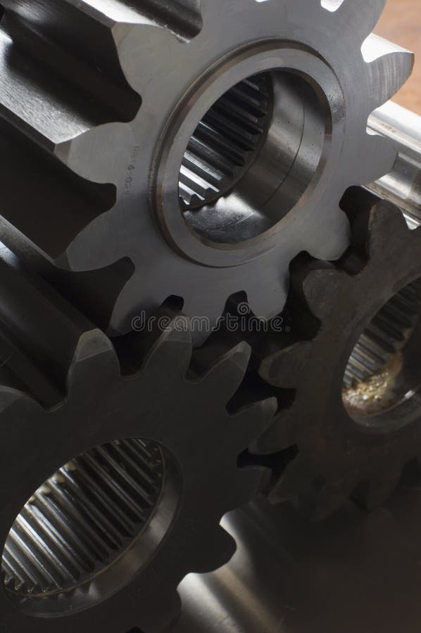 Three Cogs Against the Light Stock Photo - Image of parts, mechanics ...